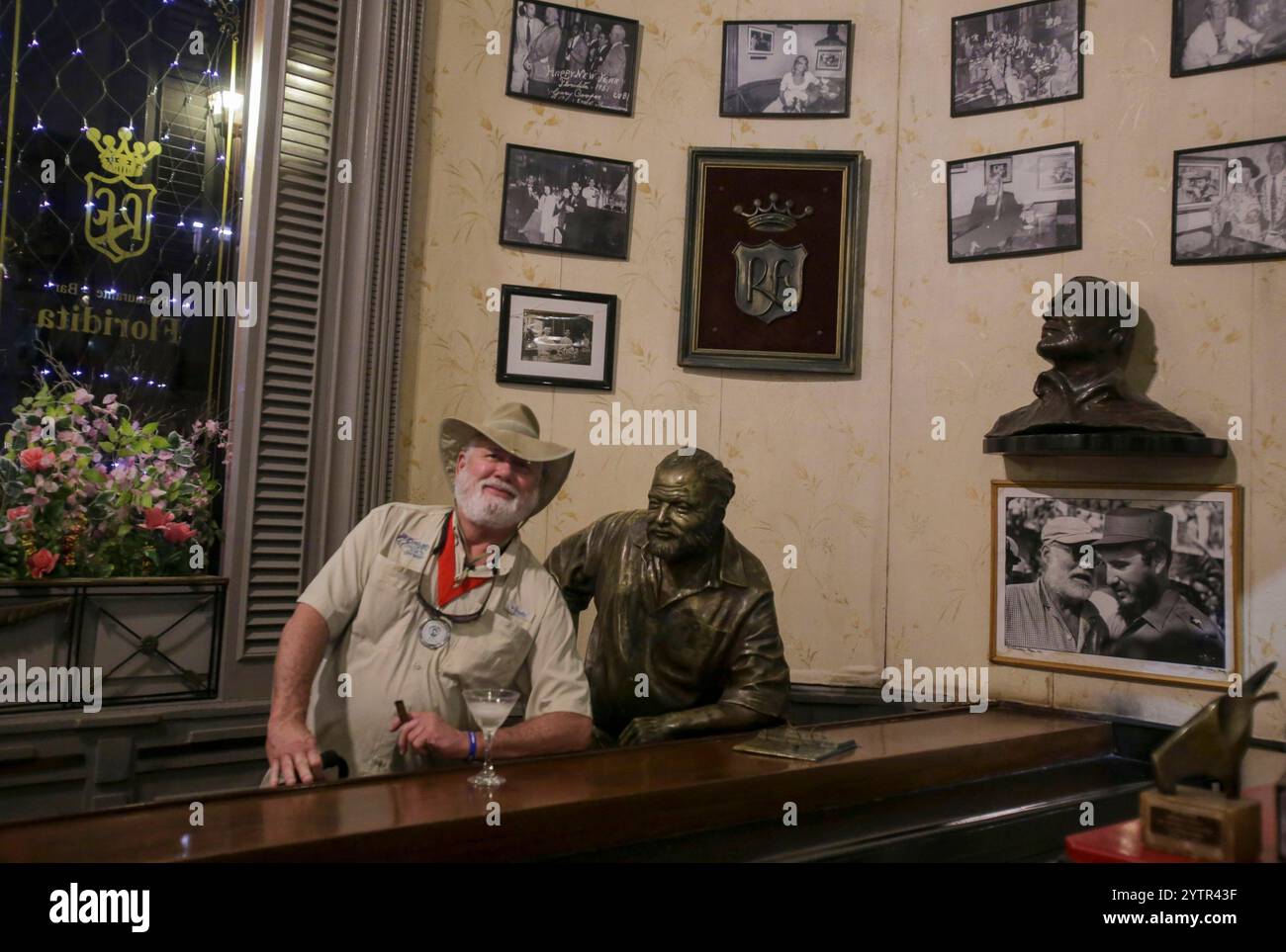 A man who pretends to look like the late American writer Ernest ...