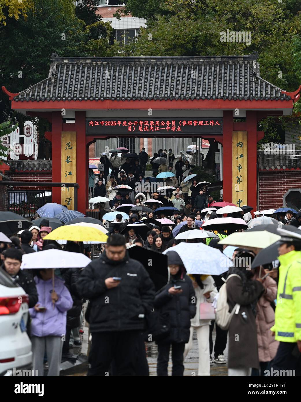 NEIJIANG, CHINA - DECEMBER 8, 2024 - Reference personnel walk out of ...