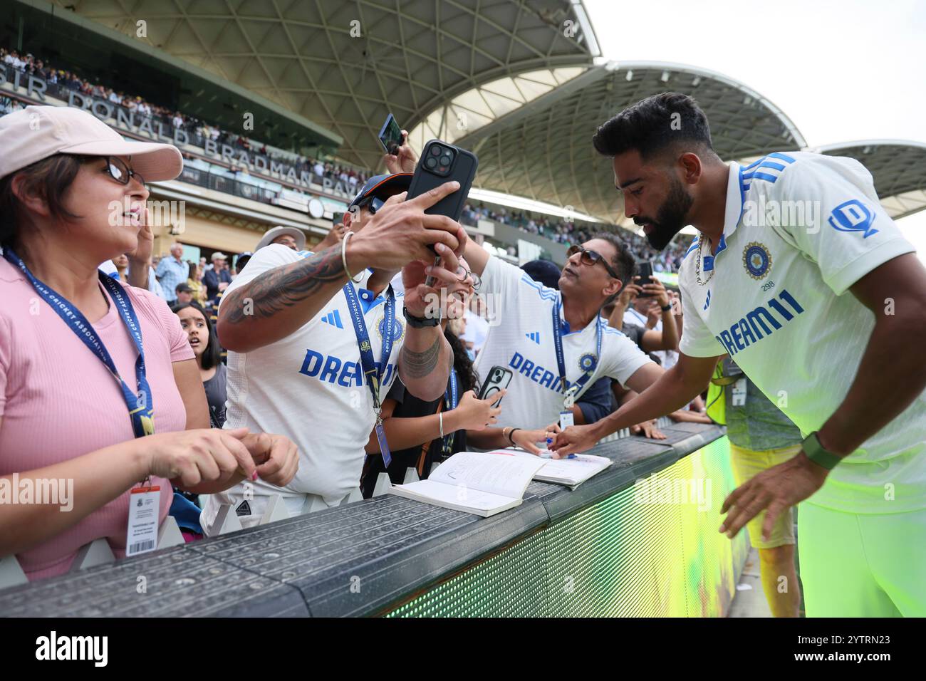 India's Mohammed Siraj signs autographs for fans after the second ...