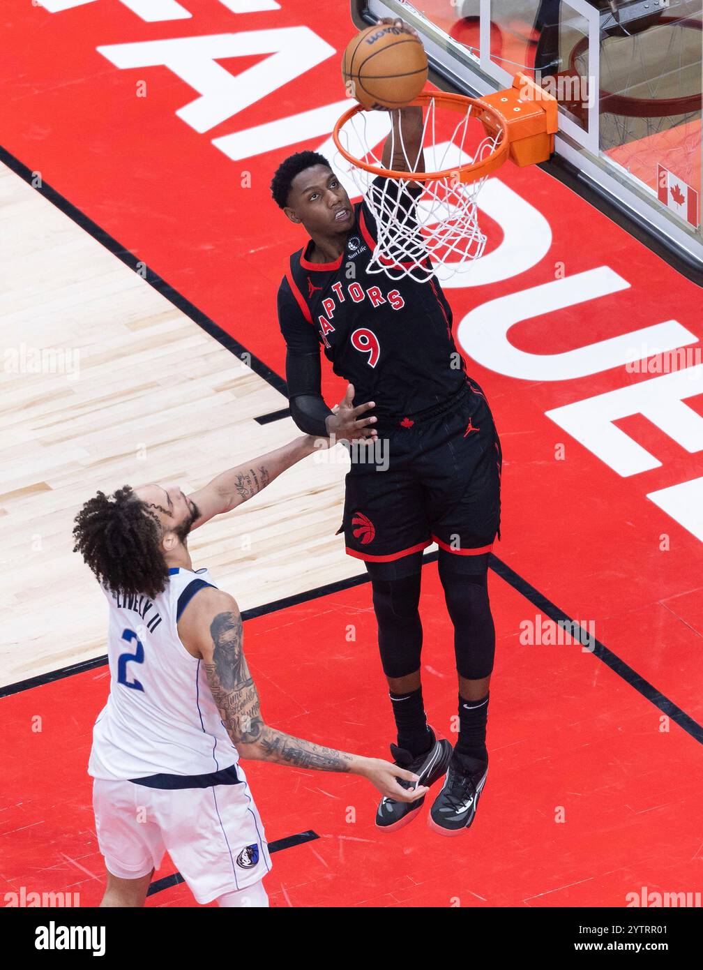 Toronto, Canada. 7th Dec, 2024. RJ Barrett (R) of Toronto Raptors dunks during the 2024-2025 NBA ...