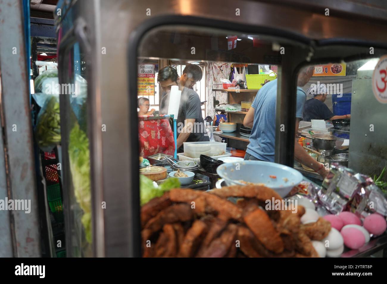 Bangkok, Thailand - November 16, 2024: man cooking on kitchen of Raan ...