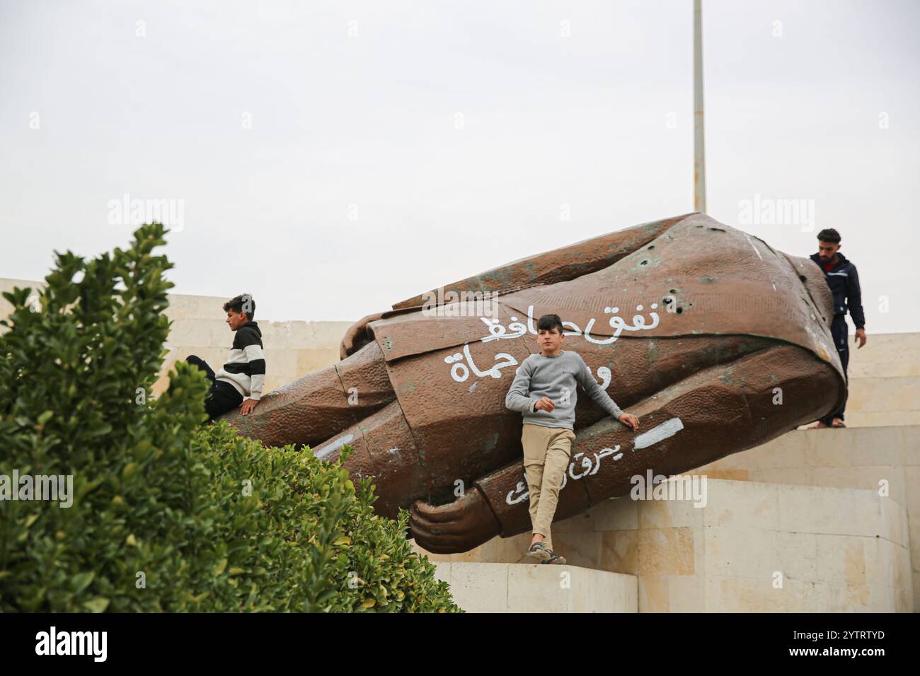 Hama, Syria. 07 December 2024. The torn down statue of former Syrian ...