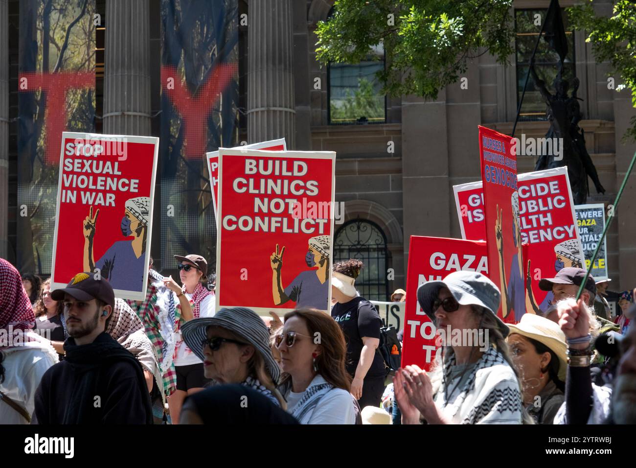 Demonstrators display placards at a pro Palestinian rally in Melbourne ...