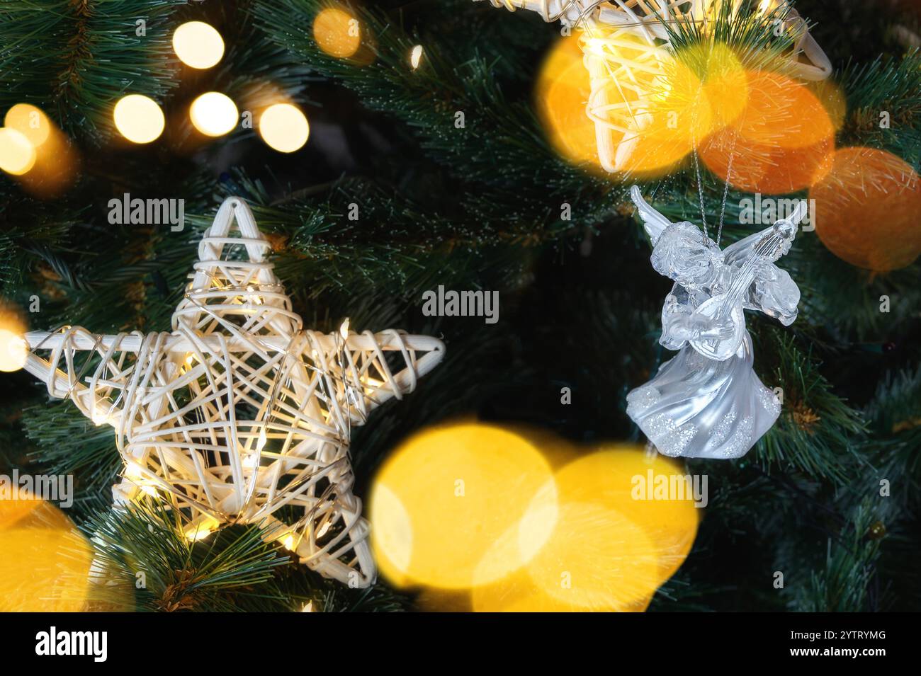 glass angel decorates the Christmas tree. Delicate Angel Ornament on ...