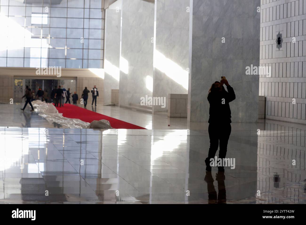 Syrian opposition fighters walk inside the Presidential Palace after ...