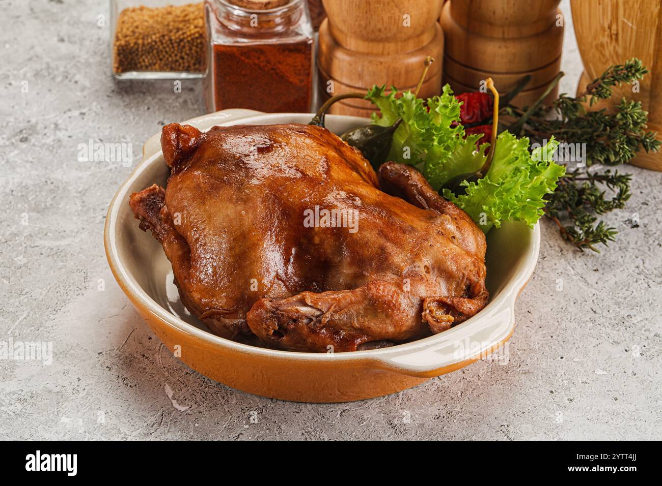 Baked whole small chicken with spices Stock Photo - Alamy