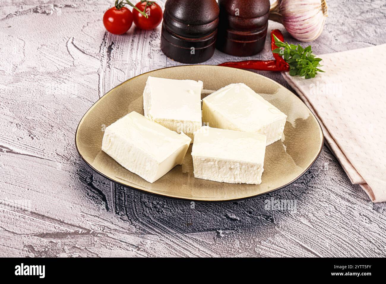 Greek traditional cuisine - Feta cheese bricks Stock Photo - Alamy