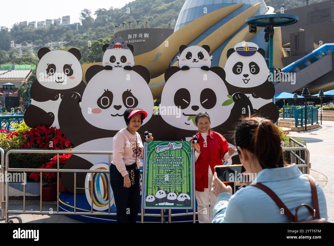 People take pictures with the panda decoration as the Beijing-gifted ...