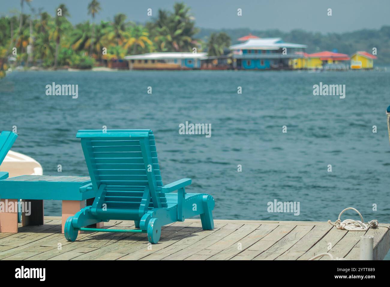 Beach chairs for resting at a pier or dock at beautiful destination of ...