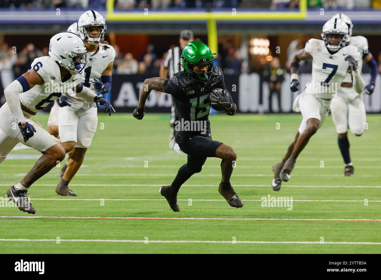 December 7, 2024: Oregon Ducks wide receiver Tez Johnson (15) scores on ...