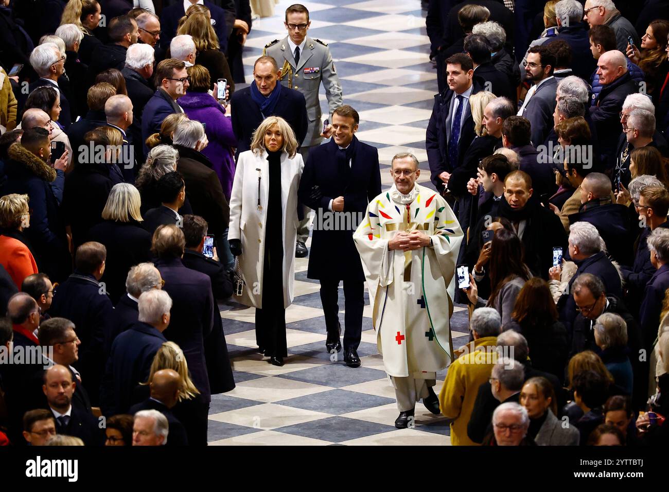 French President Emmanuel Macron, center, and his wife Brigitte Macron ...