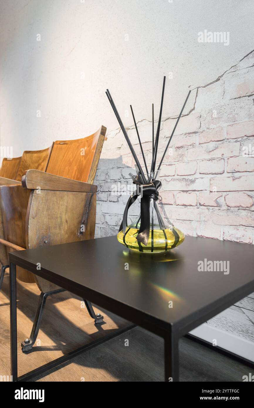 Aromatic reed air freshener on black table. Design. Elegance Stock ...