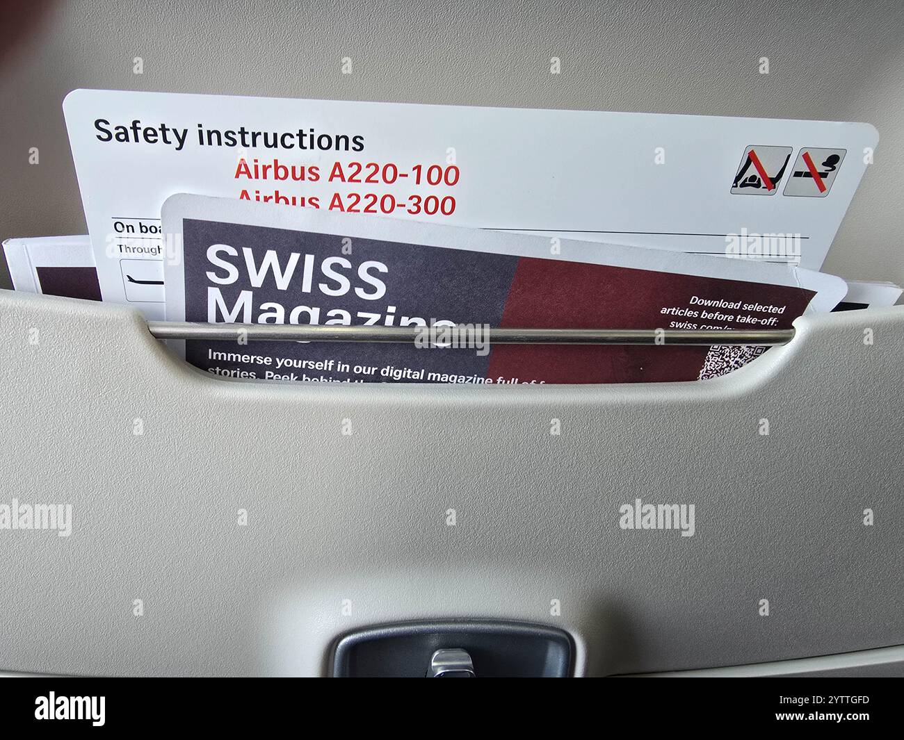 Aircraft safety instruction card for an Airbus A220 of Swiss airline ...