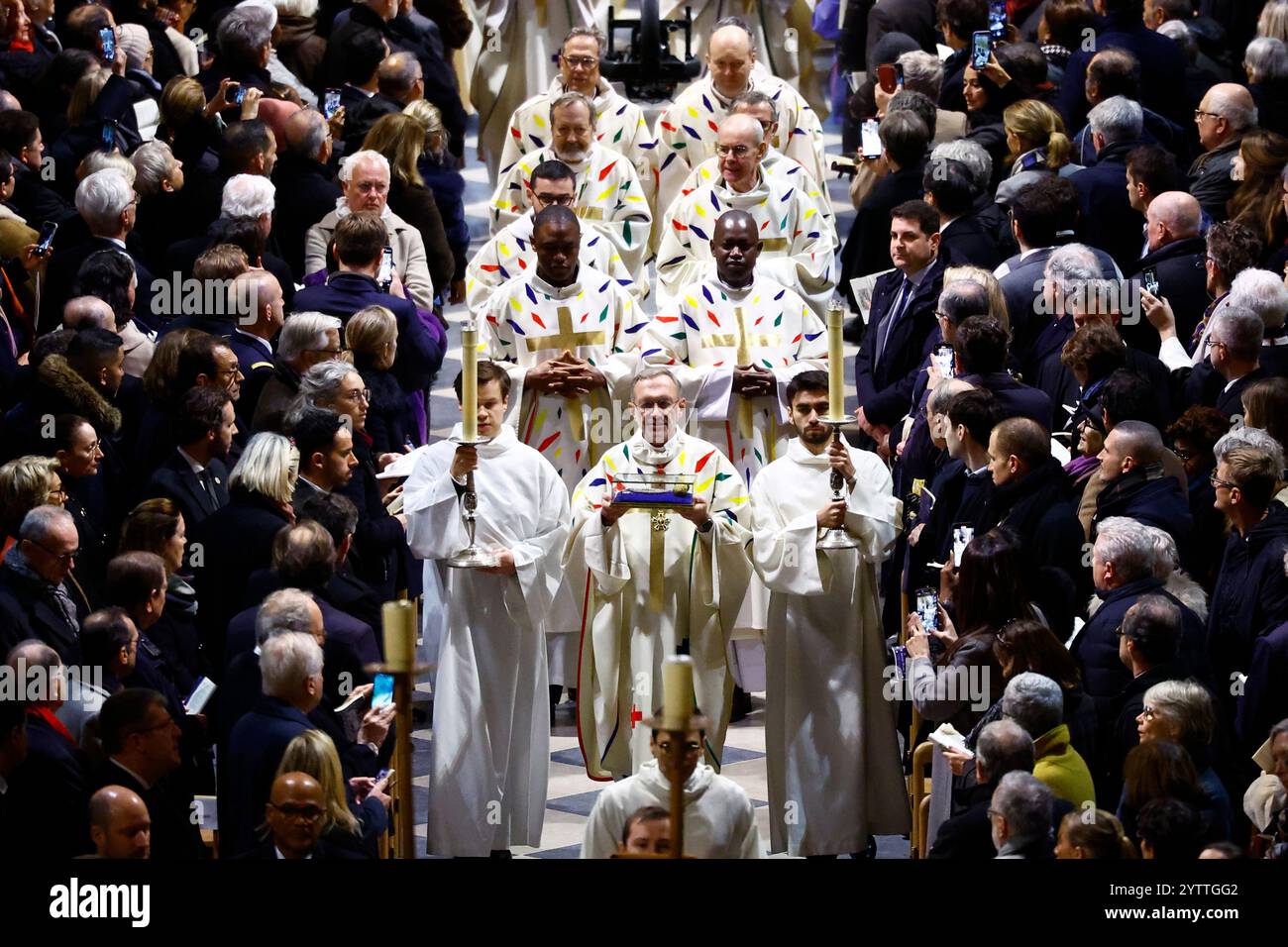 Priests and clergy arrive to attend an inaugural Mass, with the ...