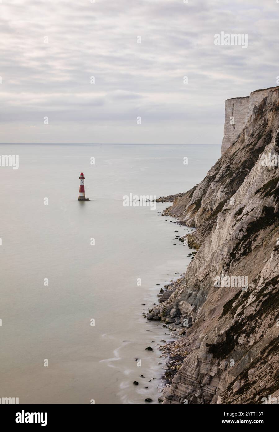 A serene long exposure photograph of Beachy Head Lighthouse captured ...
