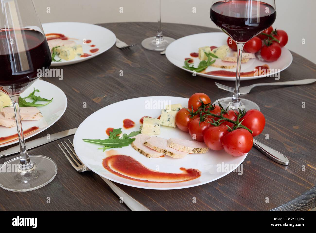 An Elegant Dining Setup Featuring Gourmet Chicken Paired with a ...