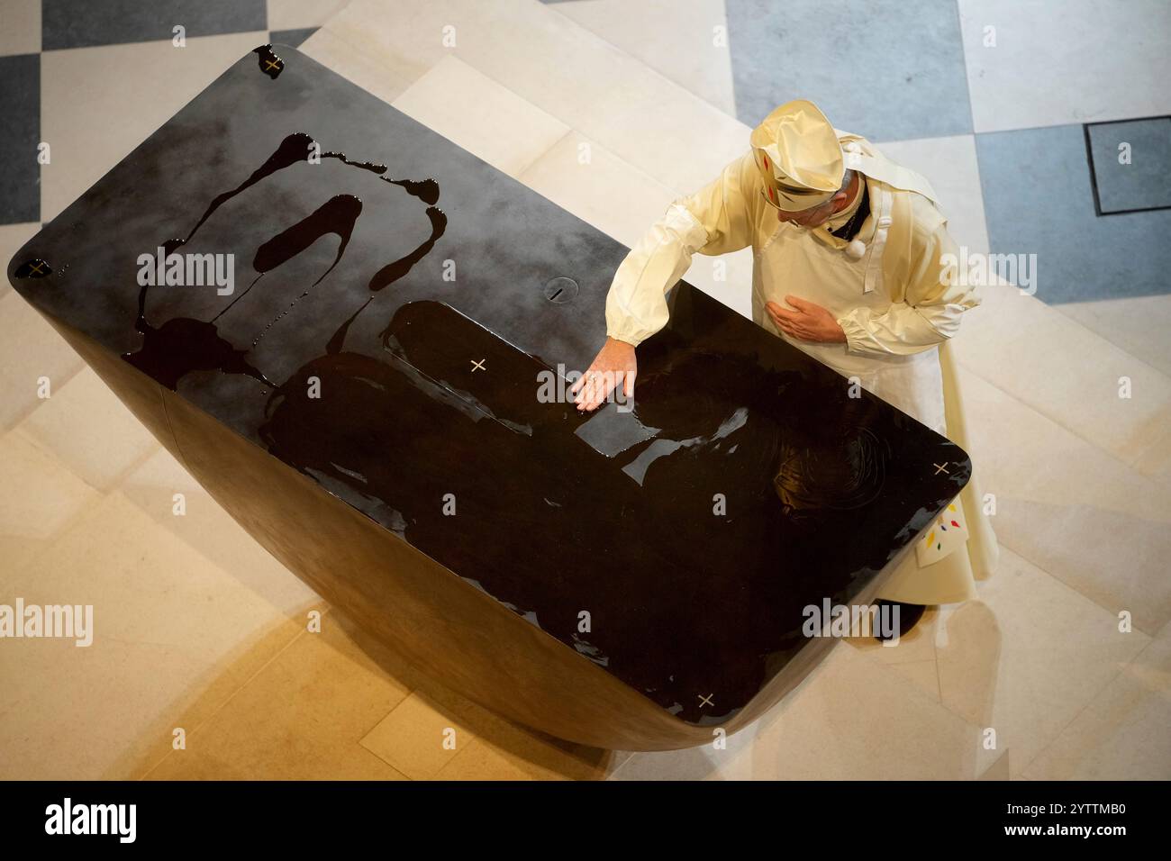 Archbishop Laurent Ulrich blesses the altar during the inaugural mass ...