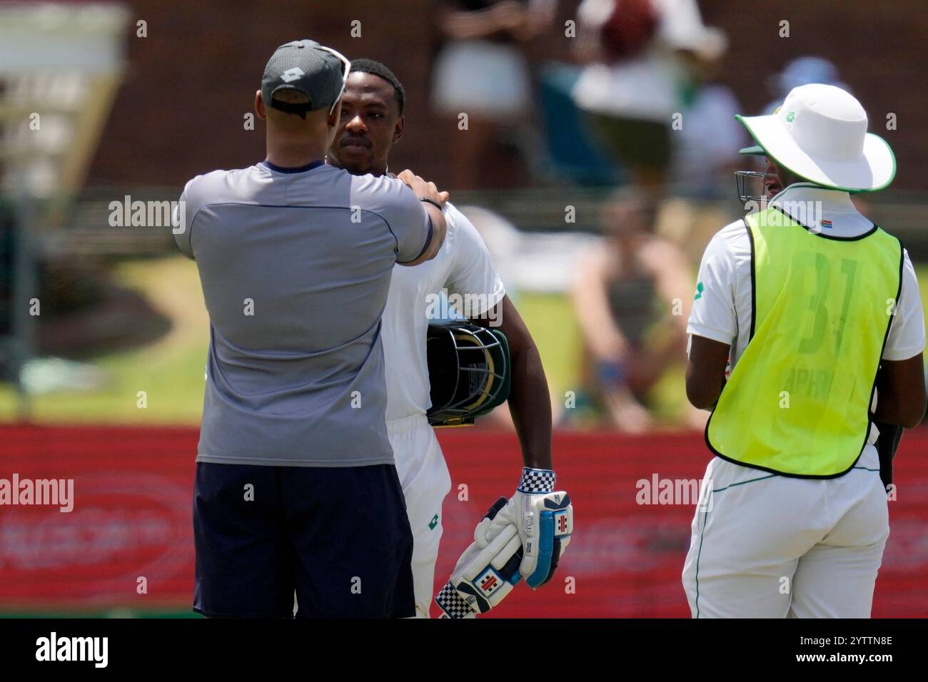 South Africa's Kagiso Rabada, second left, is checked by a team doctor ...