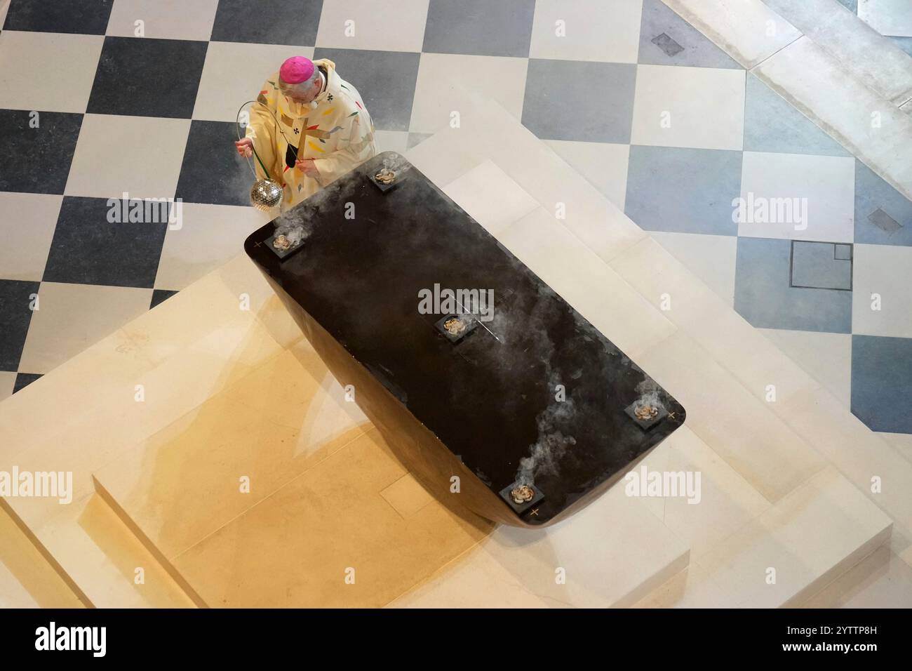Archbishop Laurent Ulrich spreads incense at the altar during the ...