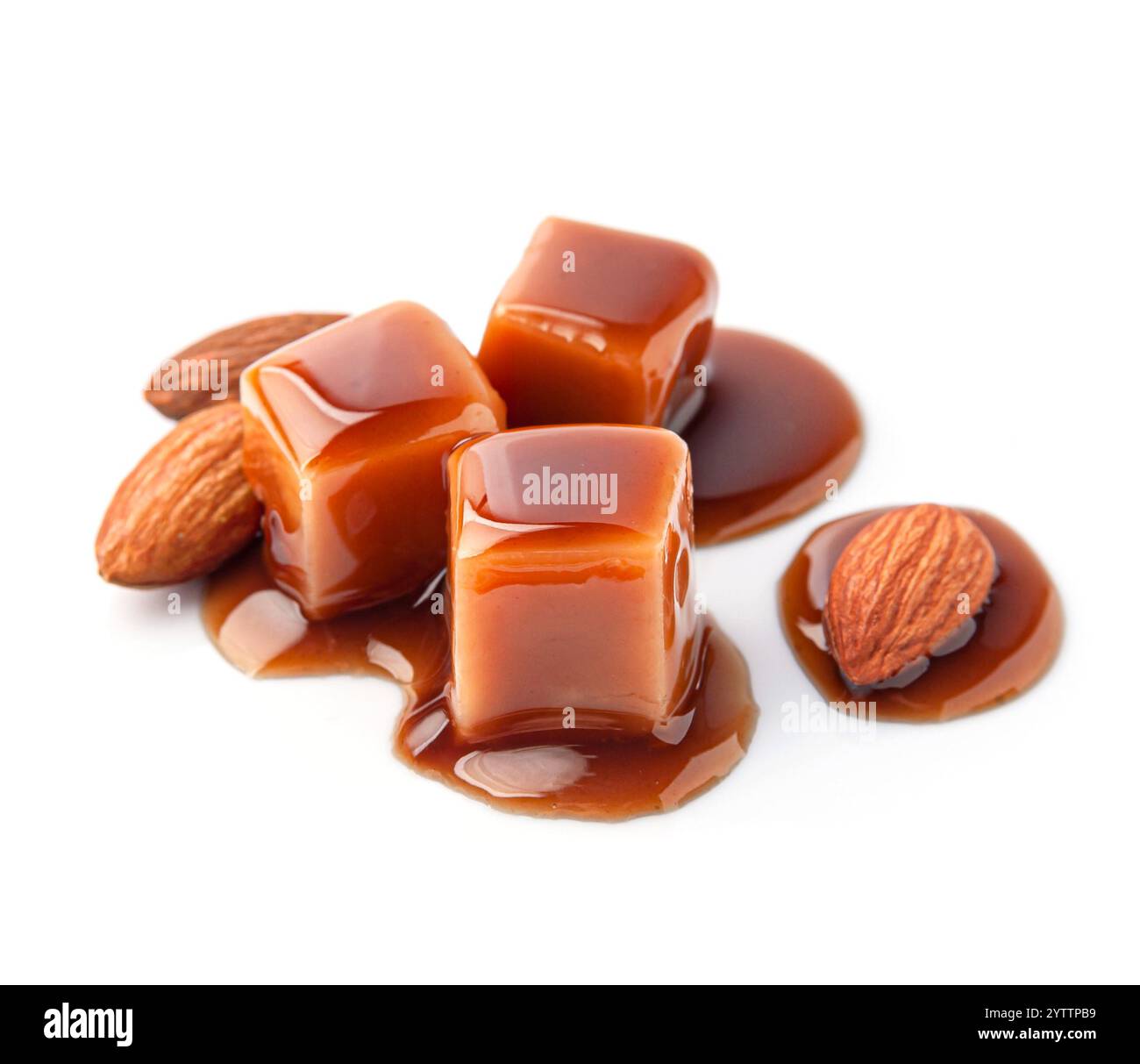 Caramel candy with caramel topping and almonds nuts on white ...