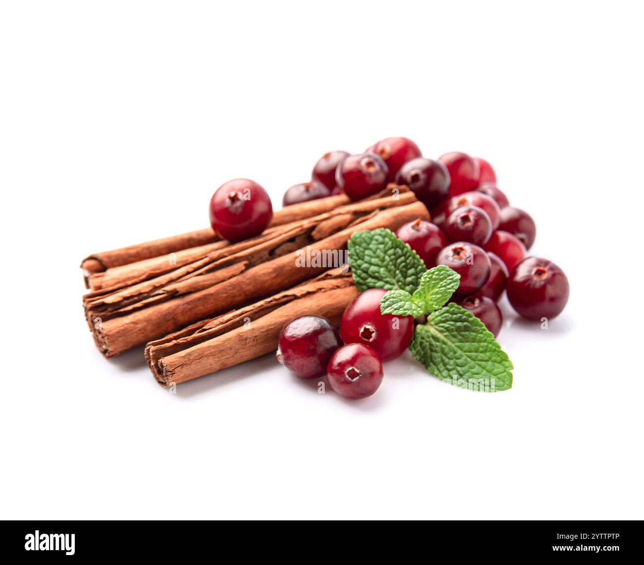Cinnamon pods and cranberries on white backgrounds. Fragrant spice and ...