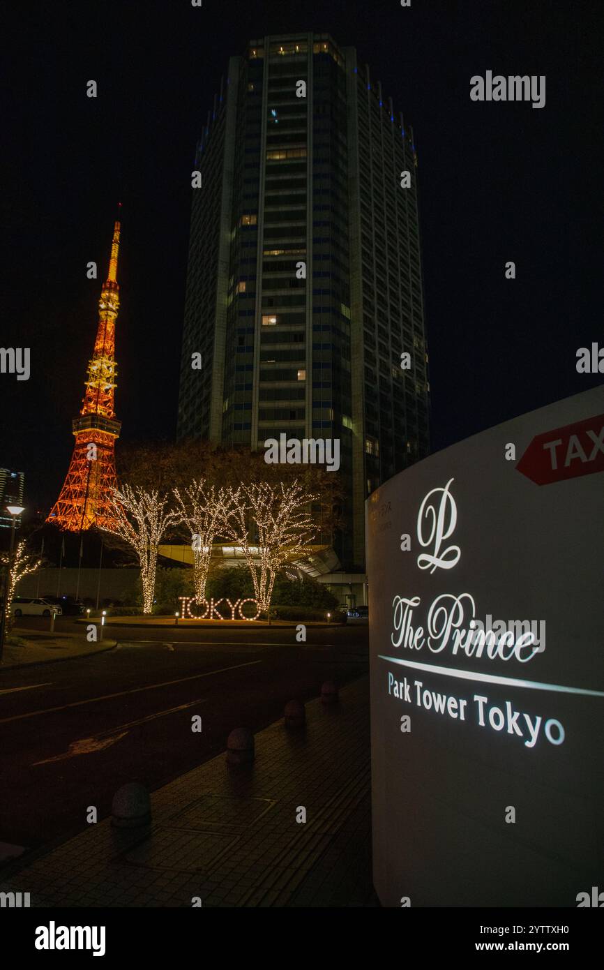The Tokyo Tower lit up at night, seen next to The Prince Park Tower ... The Tokyo Tower lit up at night, seen next to The Prince Park Tower ...