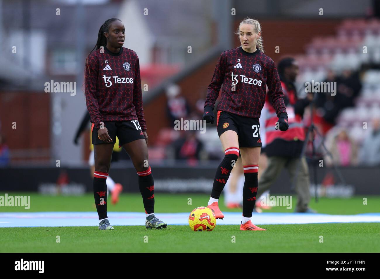 Leigh, UK. 08th Dec, 2024. Millie Turner of Manchester United and Simi ...
