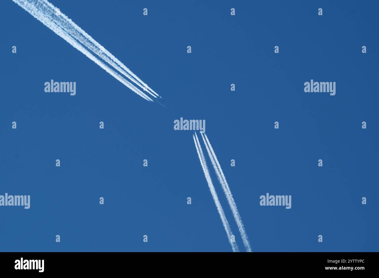 Airplane trail in the clear blue sky. Traces of aircraft Stock Photo ...