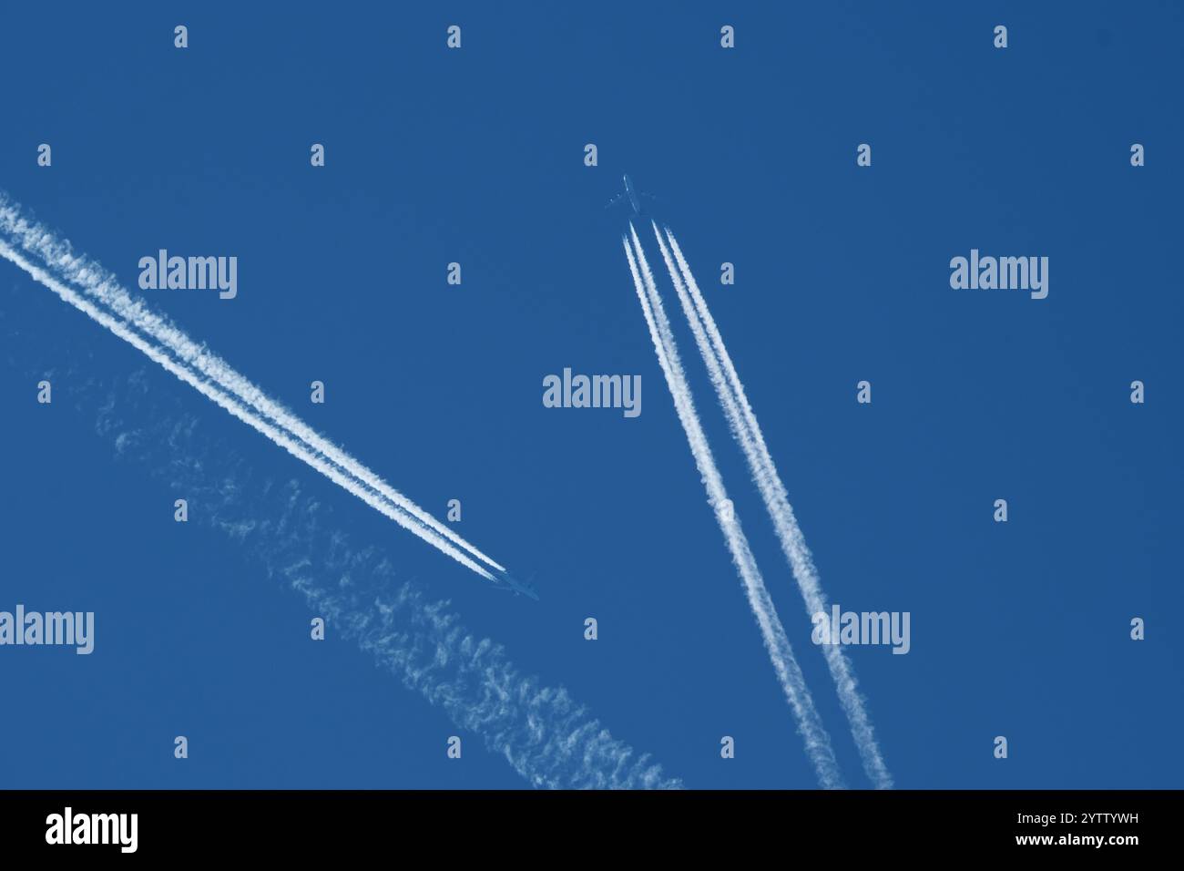 Airplane trail in the clear blue sky. Traces of aircraft Stock Photo ...