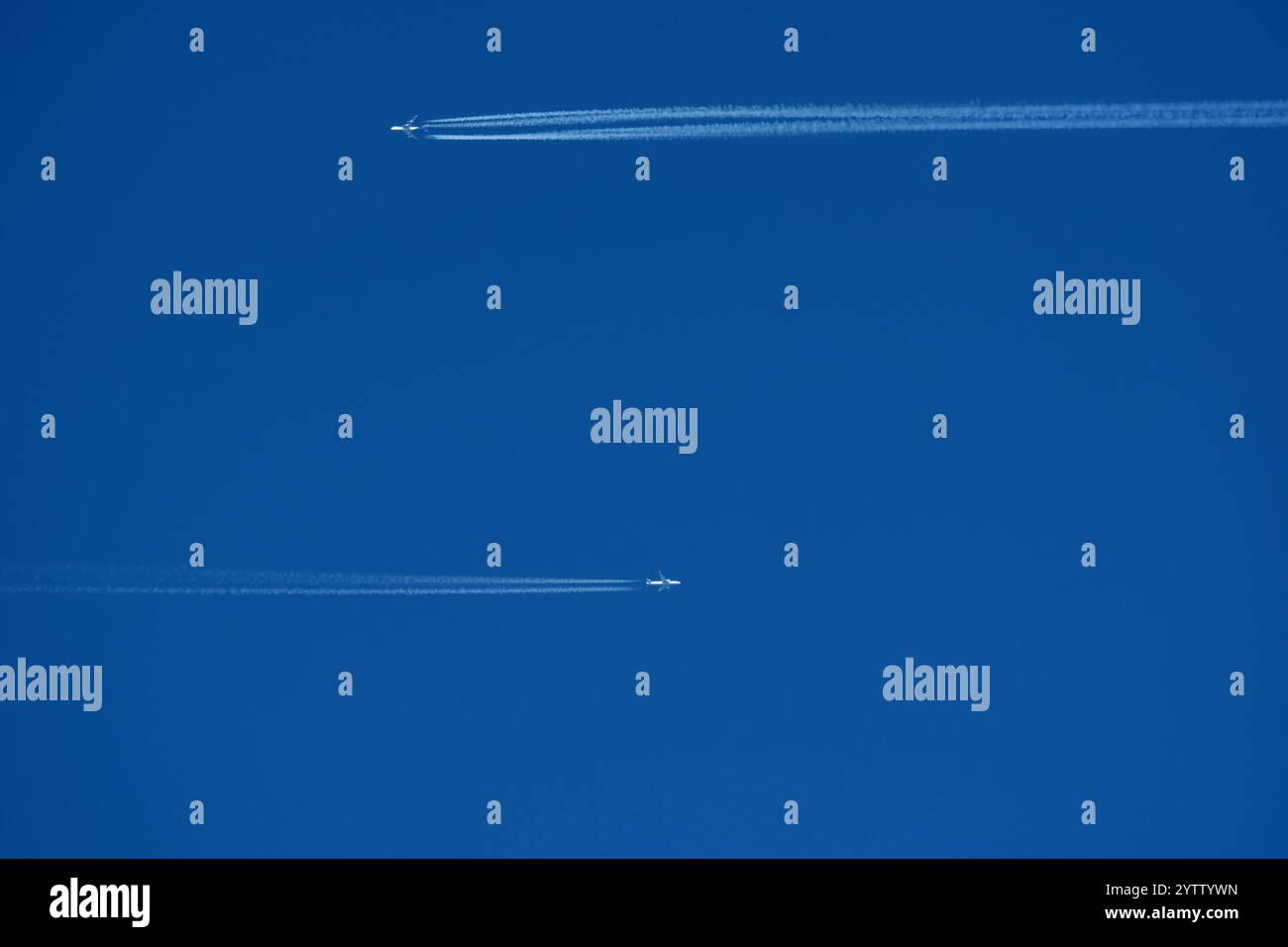 Airplane trail in the clear blue sky. Traces of aircraft Stock Photo ...