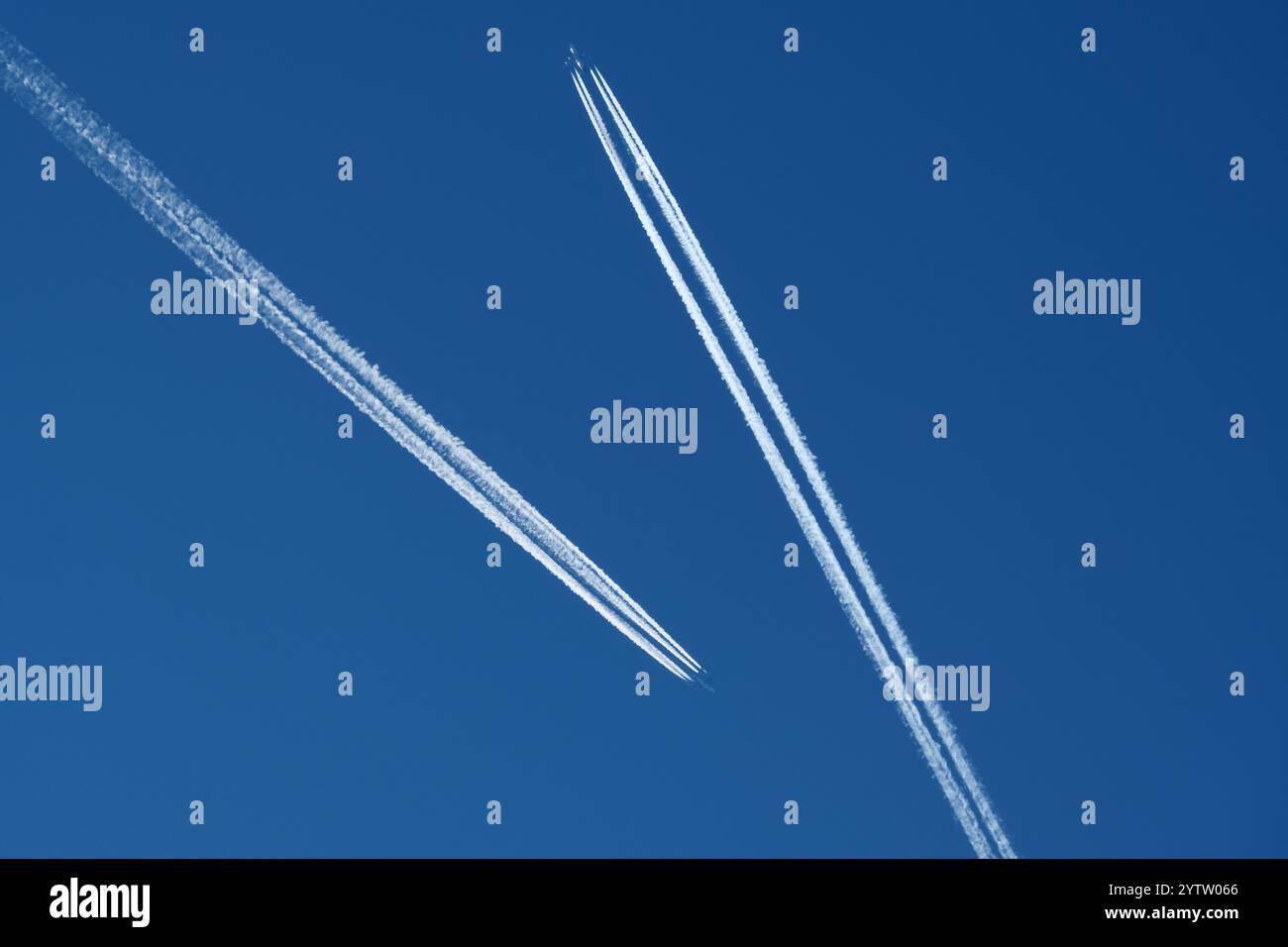 Airplane trail in the clear blue sky. Traces of aircraft Stock Photo ...
