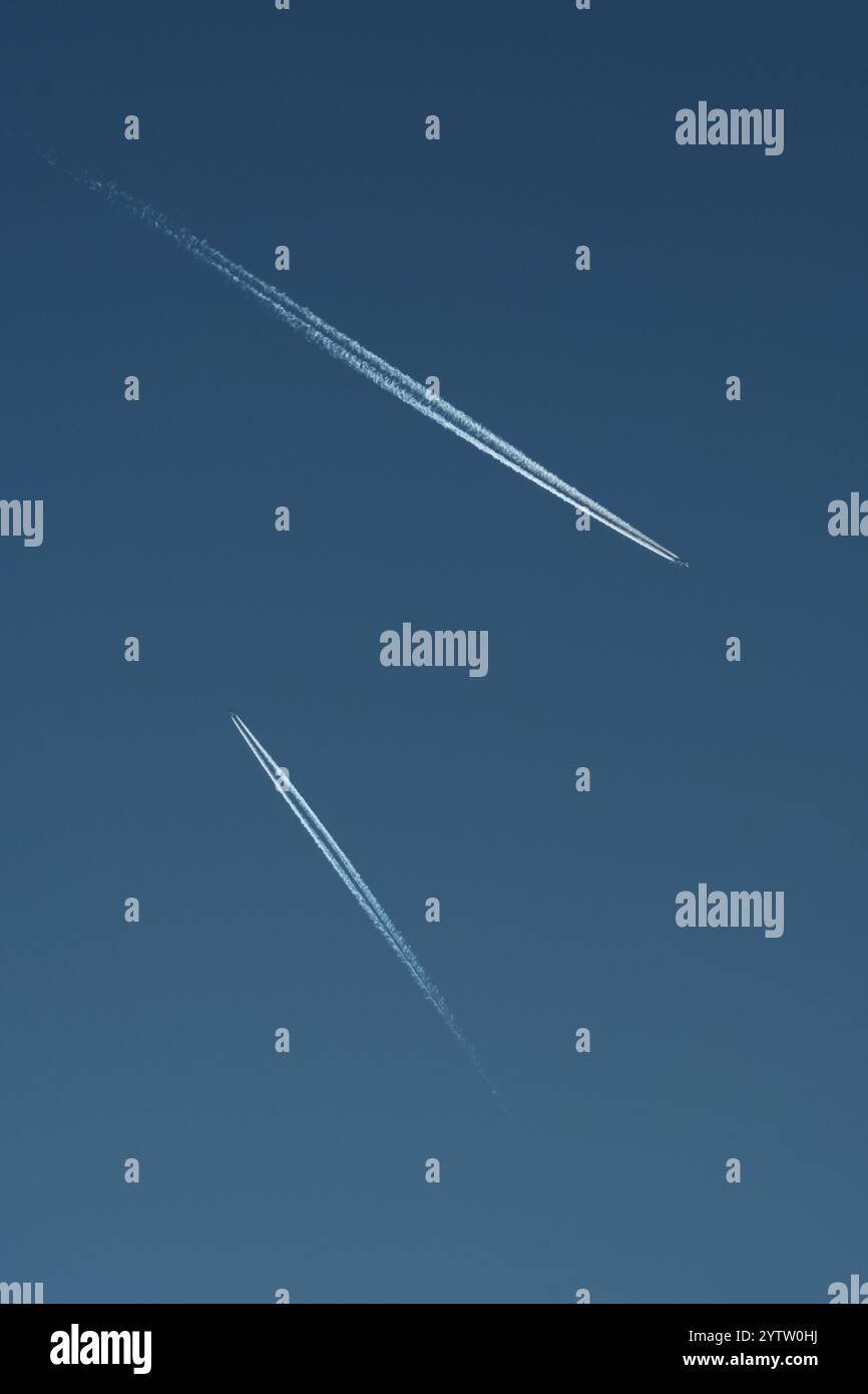 Airplane trail in the clear blue sky. Traces of aircraft Stock Photo ...