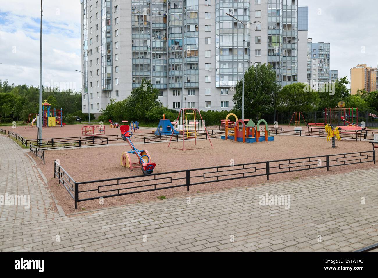 A Vibrant Playground Set in an Urban Landscape, Complete with Colorful ...