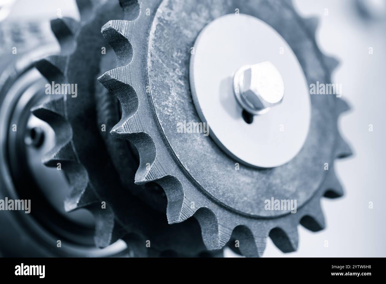A gear with a bolt on it. The gear is silver Stock Photo - Alamy