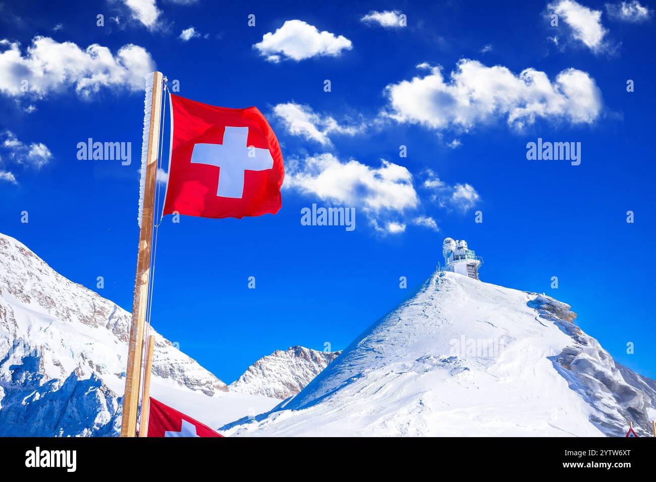 Swiss flag on Jungfraujoch peak and Sphinx observatory view, Berner ...