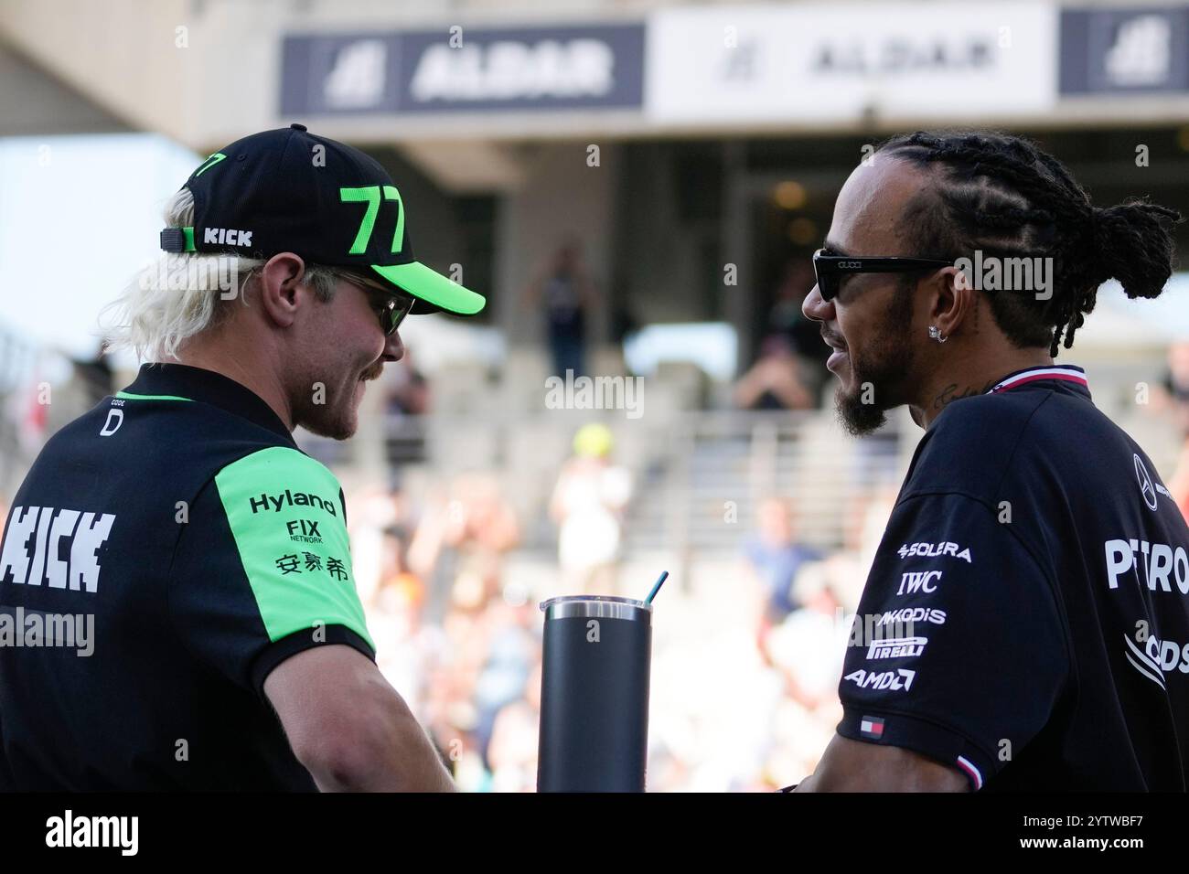 Kick Sauber driver Valtteri Bottas of Finland, left, and Mercedes ...
