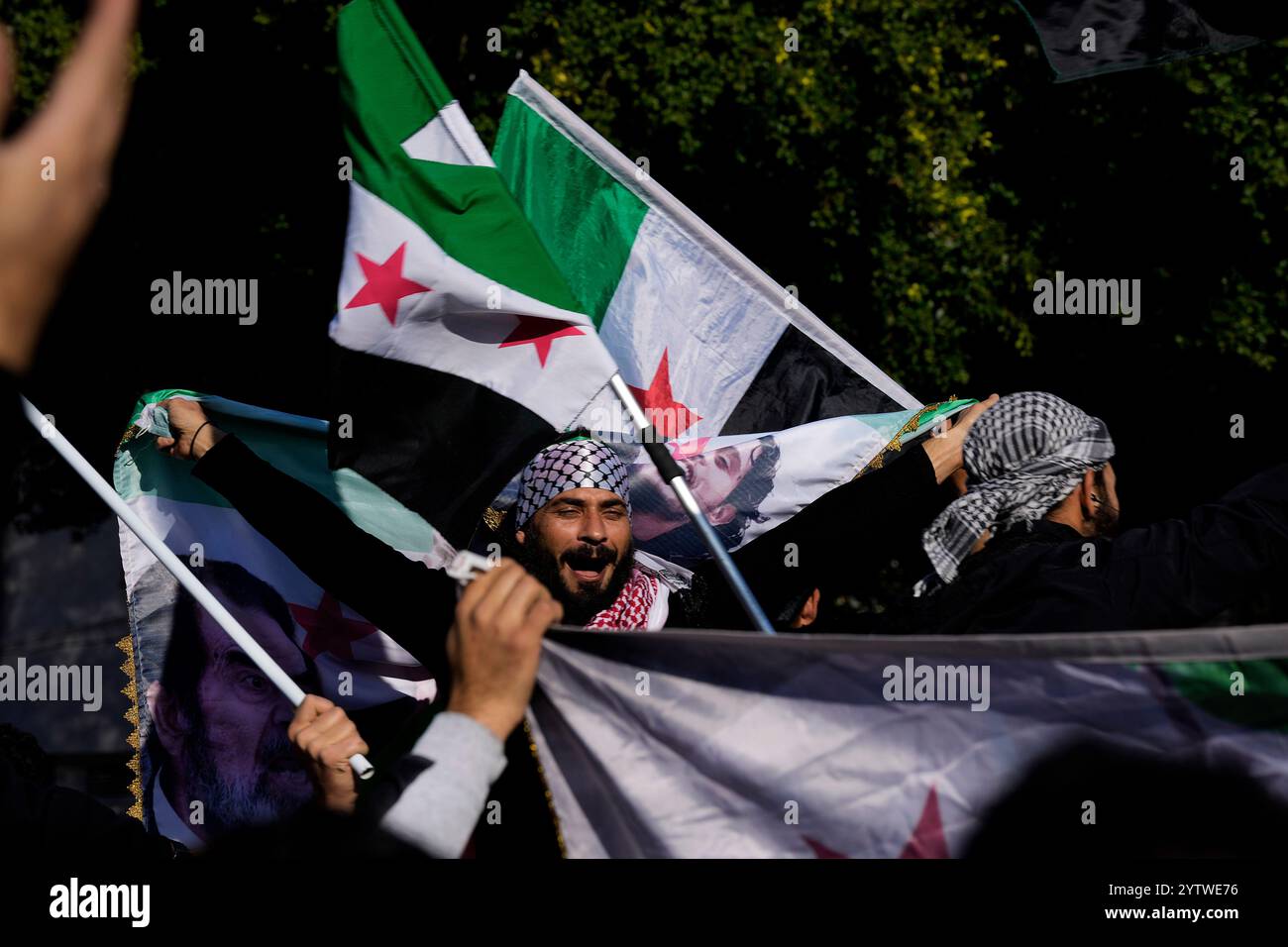 Syrians in Cyprus wave flags of what they say are of a liberated Syria ...