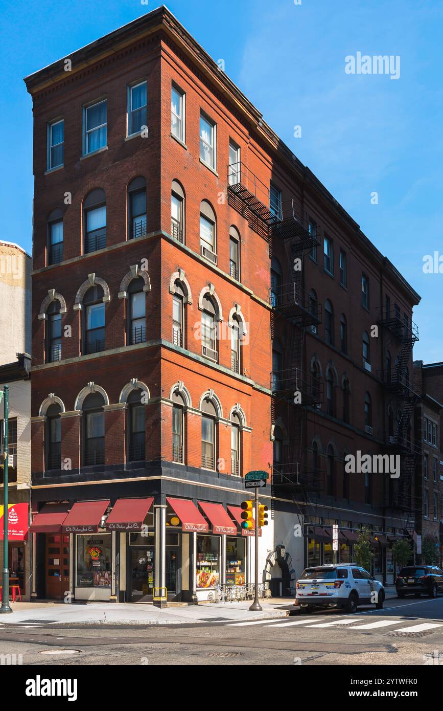 USA street corner, view of a traditional brownstone walk up apartment ...