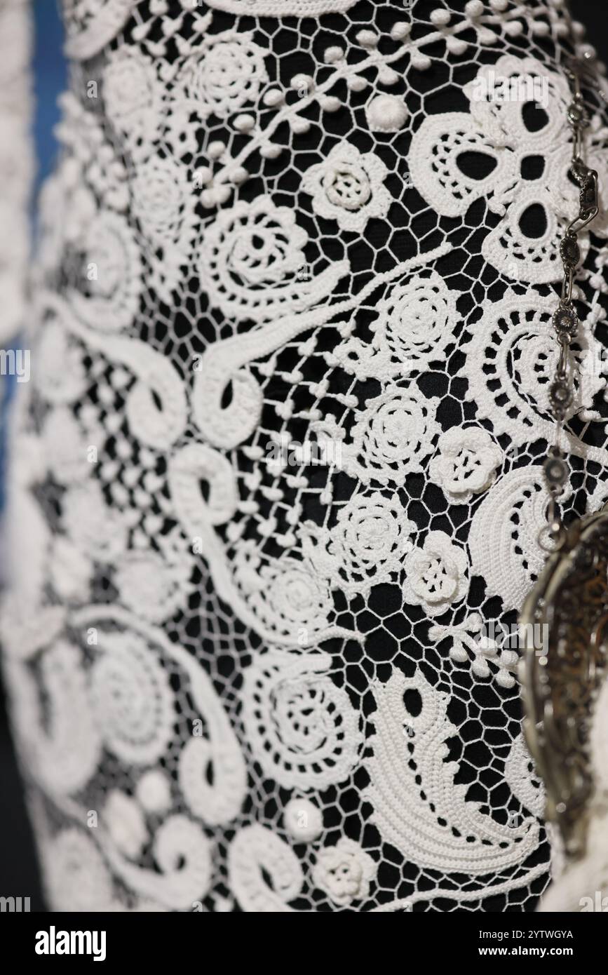 This intricate white lace design beautifully stands out against a ...