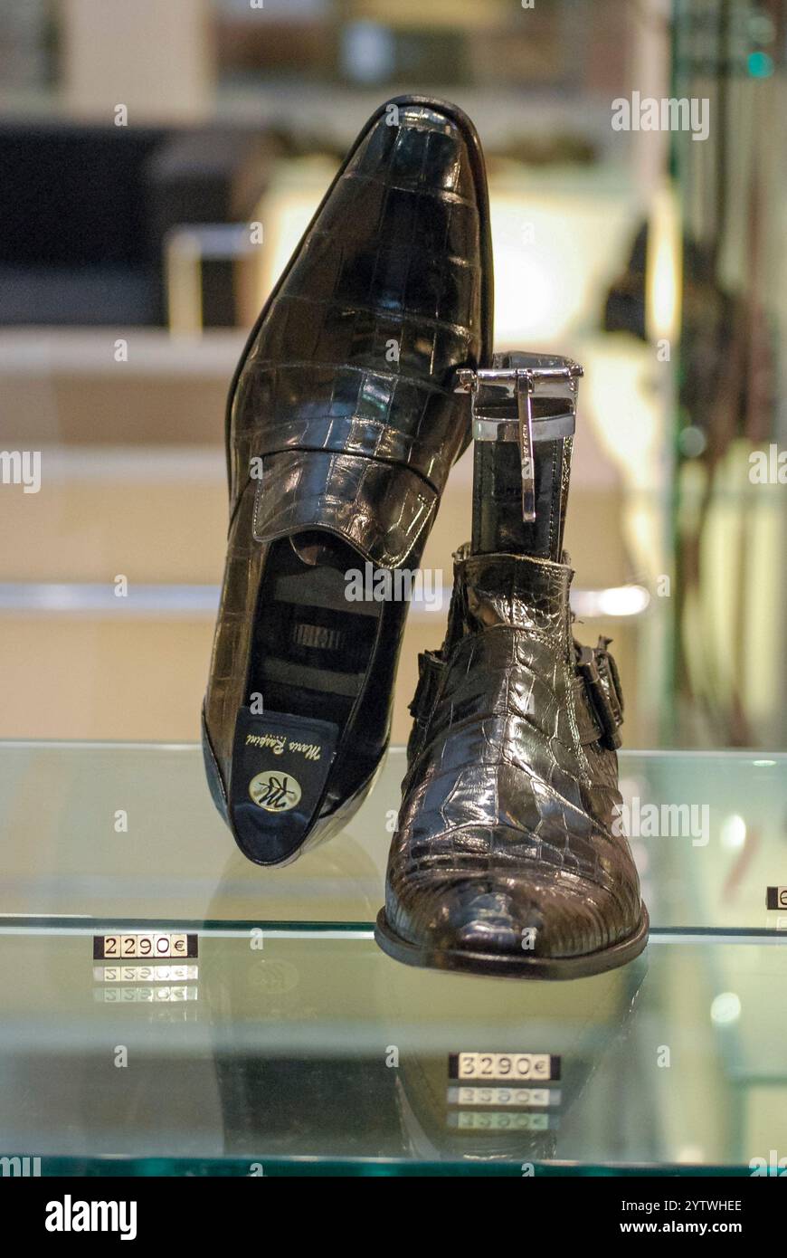 Expensive crocodile skin shoes in a shop window in Paris Stock Photo ...