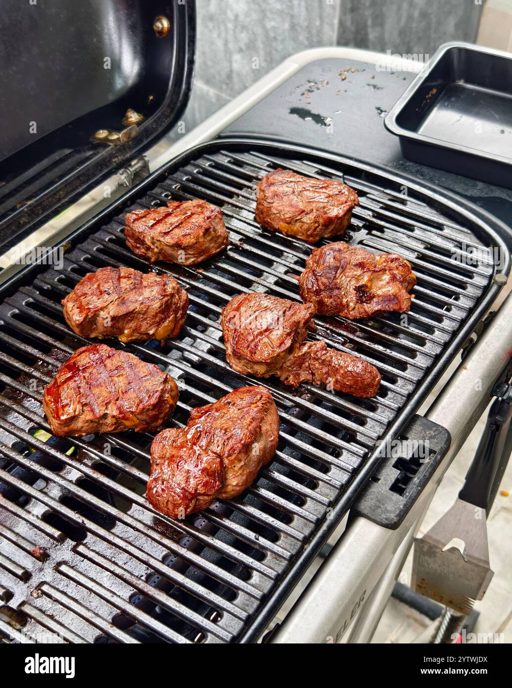 Sizzling grilled meat that showcases a perfect char Stock Photo - Alamy