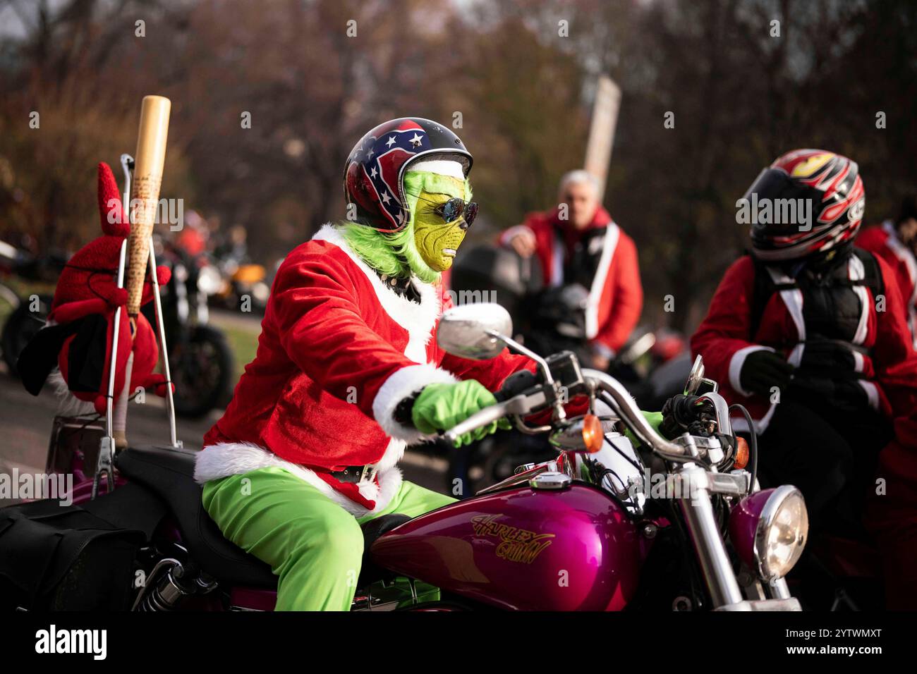 People dressed as Santa Claus and the Grinch character attend the 14th ...