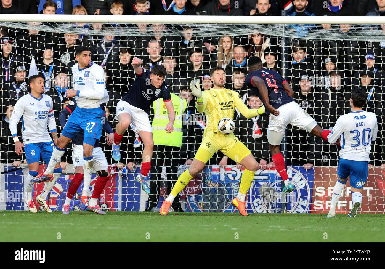 Rangers goalkeeper Jack Butland (centre) makes a save from Ross County ...