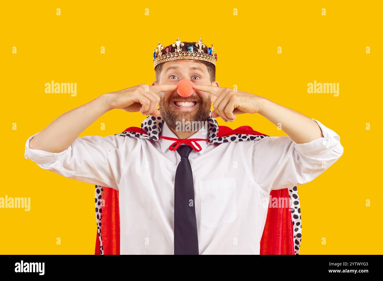 Happy funny office worker in costume of king and clown at corporate ...