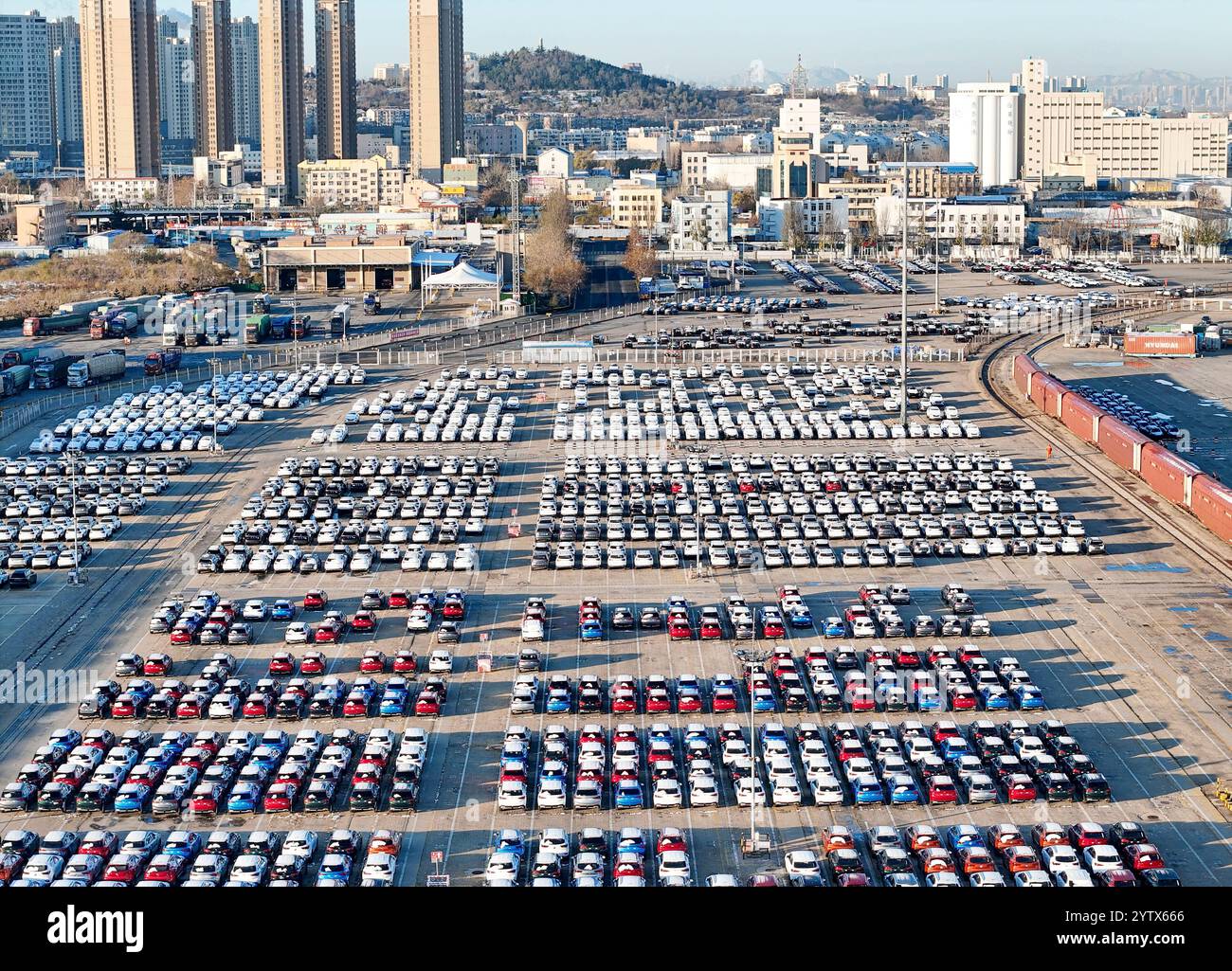 Aerial view of new cars waiting for shipment in a port in Yantai in ...