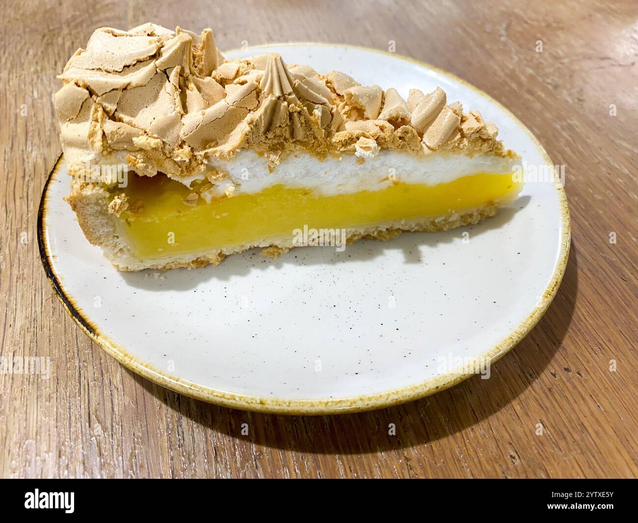 A slice of lemon meringue pie Stock Photo - Alamy