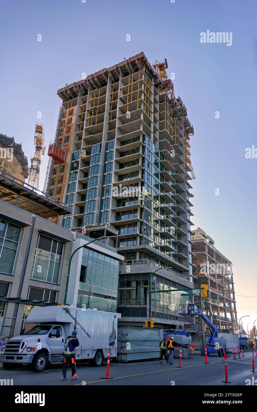 High-rise buildings under constraction with traffic management posts on ...