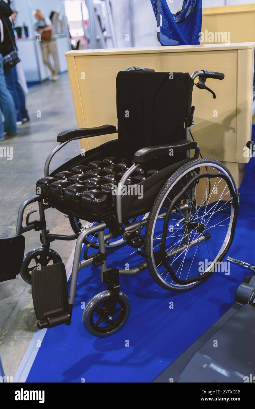 Reinforced wheelchair with brake keys for assistant Stock Photo - Alamy