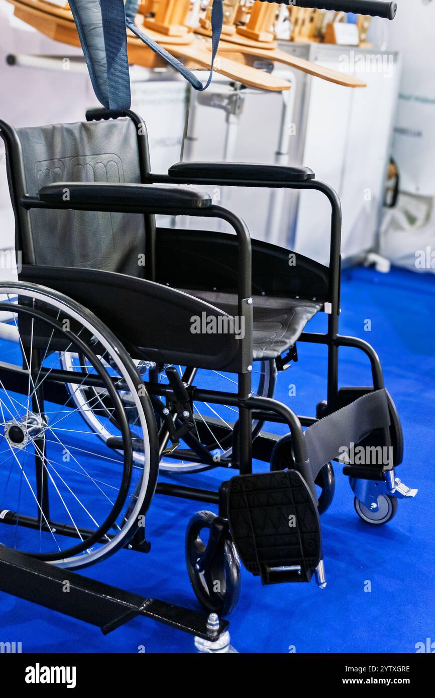 Reinforced wheelchair with brake keys for assistant Stock Photo - Alamy