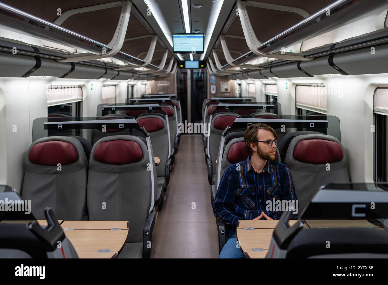 Passenger Traveling Alone in a Modern Train Stock Photo - Alamy